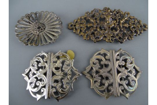 Four vintage nurse's buckles including two hallmarked silver, one white ...