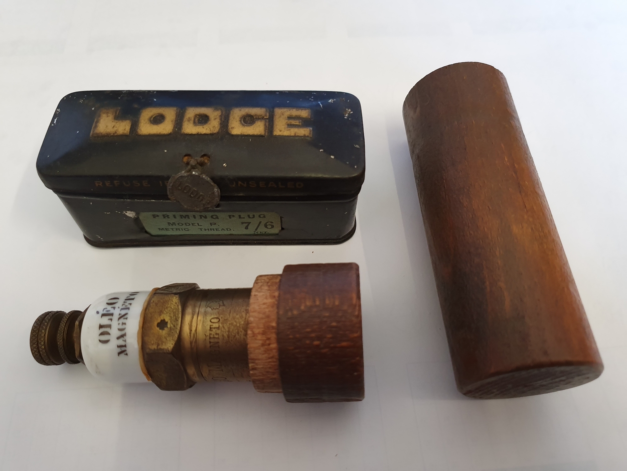 A vintage Oleo Magneto spark plug, in wooden case together with a Lodge ...