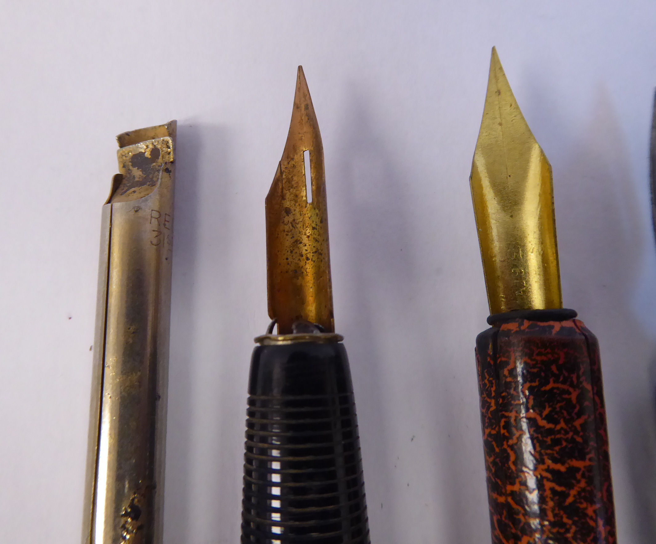 Ten various 'vintage' dip pens: to include one in white metal, on a ...