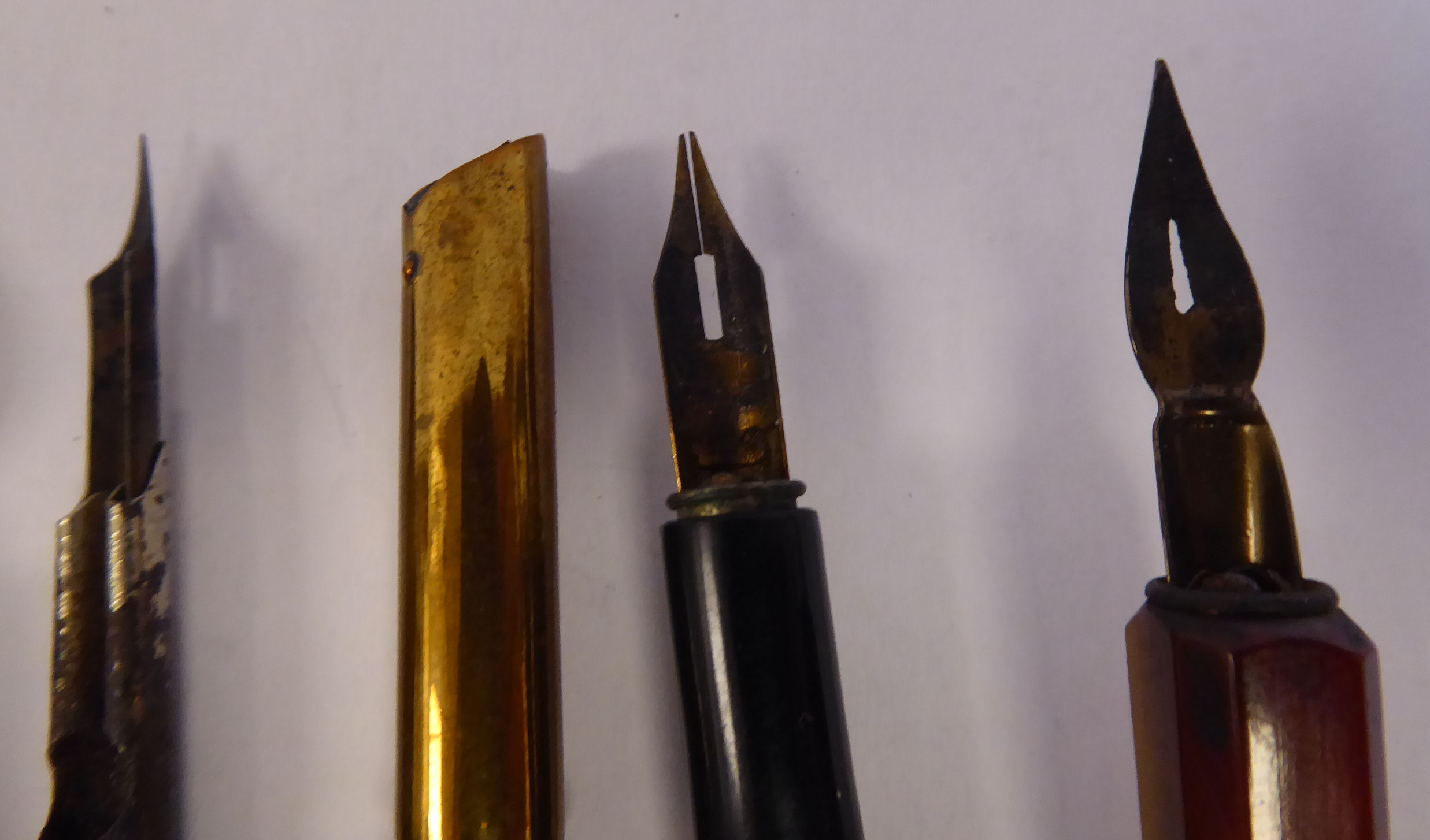 Ten various 'vintage' dip pens: to include one in white metal, on a ...