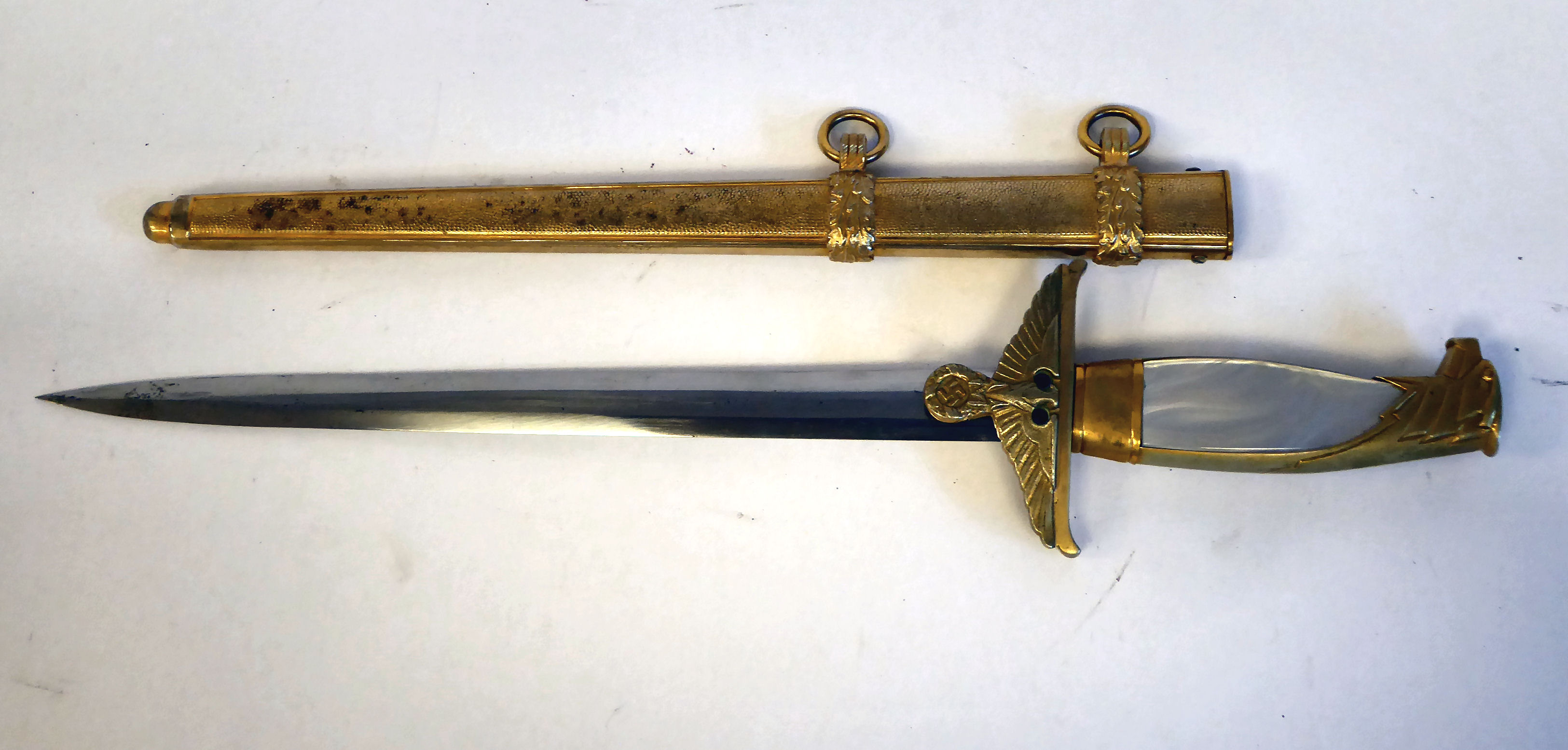 A German Diplomat's dagger with a gilded metal eagle's head pommel, a ...