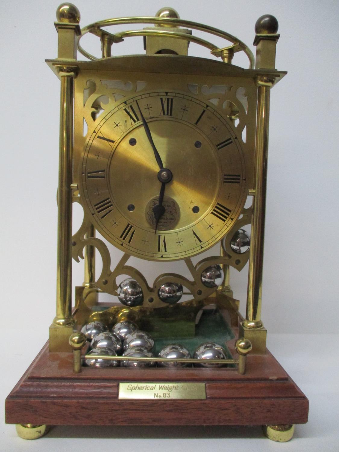 A 20th century spherical rolling ball table clock, manufactured by ...