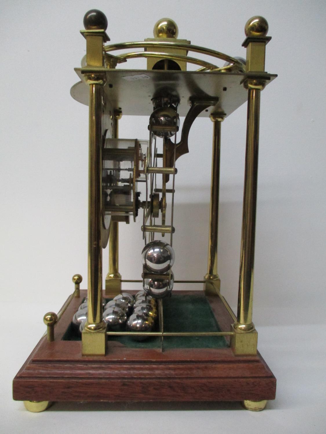 A 20th century spherical rolling ball table clock, manufactured by ...