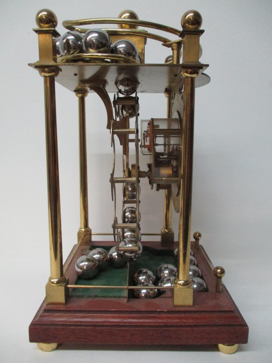 A 20th century spherical rolling ball table clock, manufactured by ...