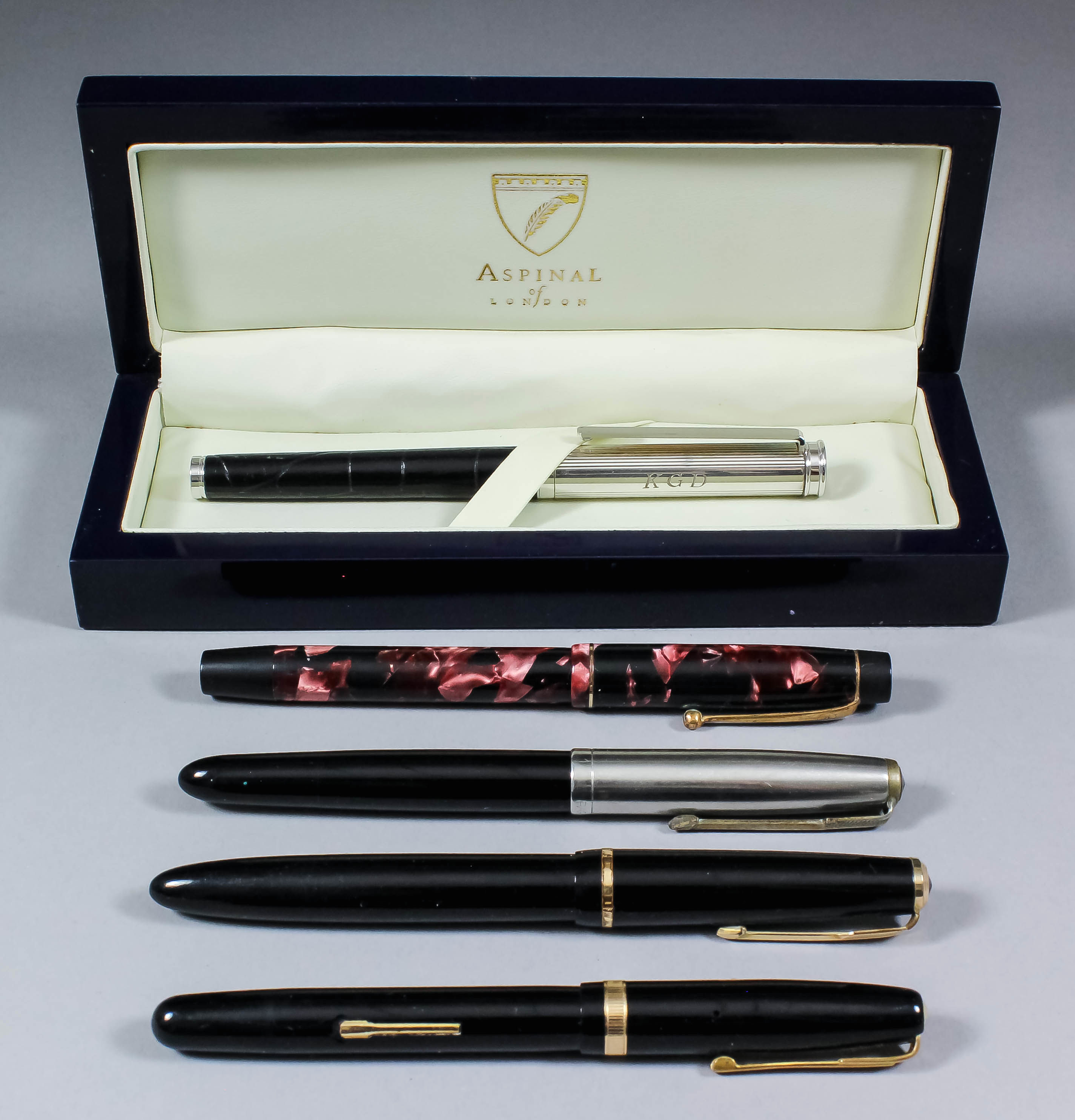 An Aspinal of London black leather and silver rollerball pen, in ...