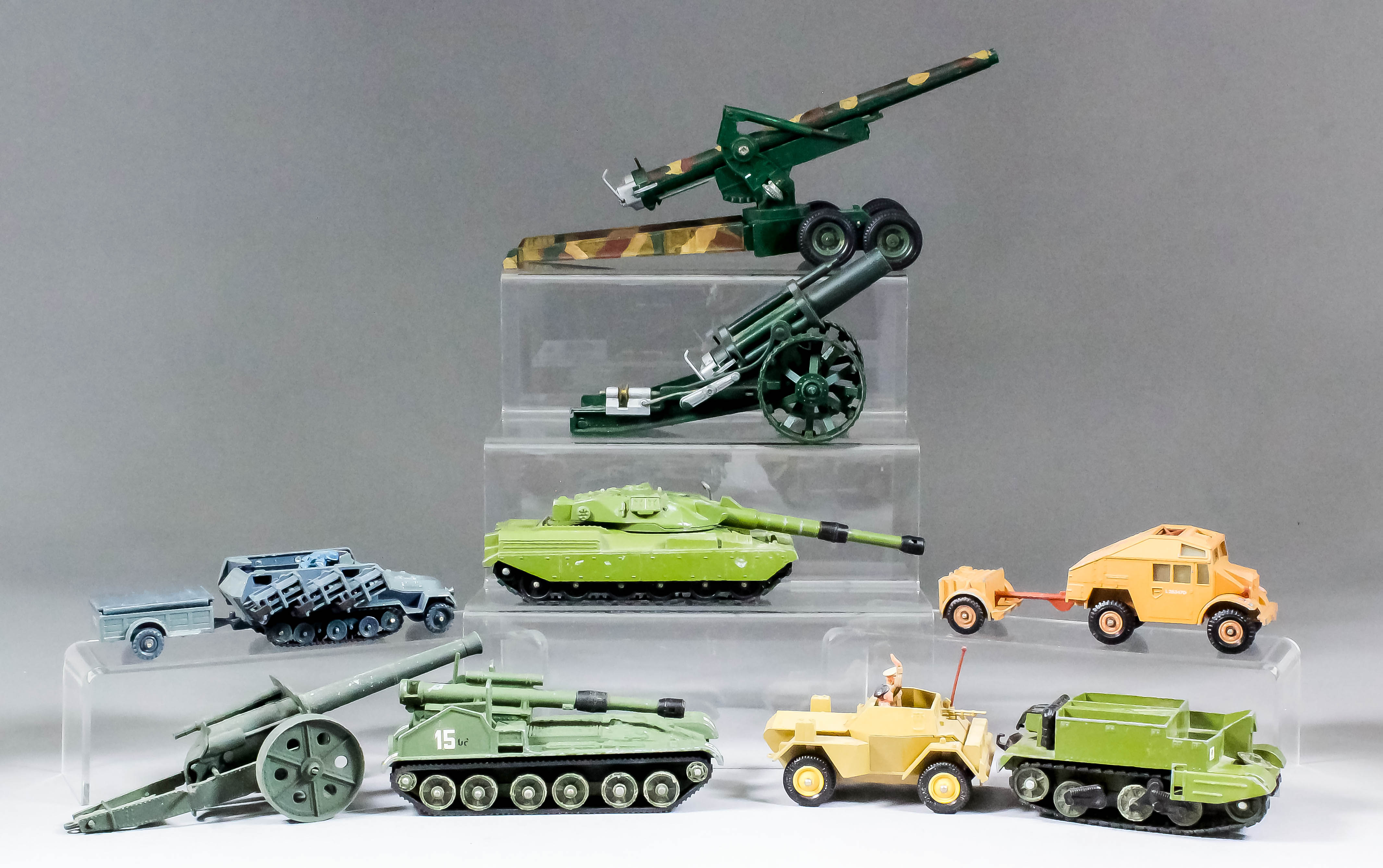 A large collection of diecast military vehicles, including - tanks ...