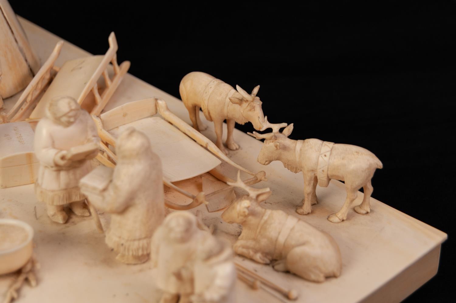 EARLY TWENTIETH CENTURY RUSSIAN CARVED IVORY GROUP, modelled as an ...