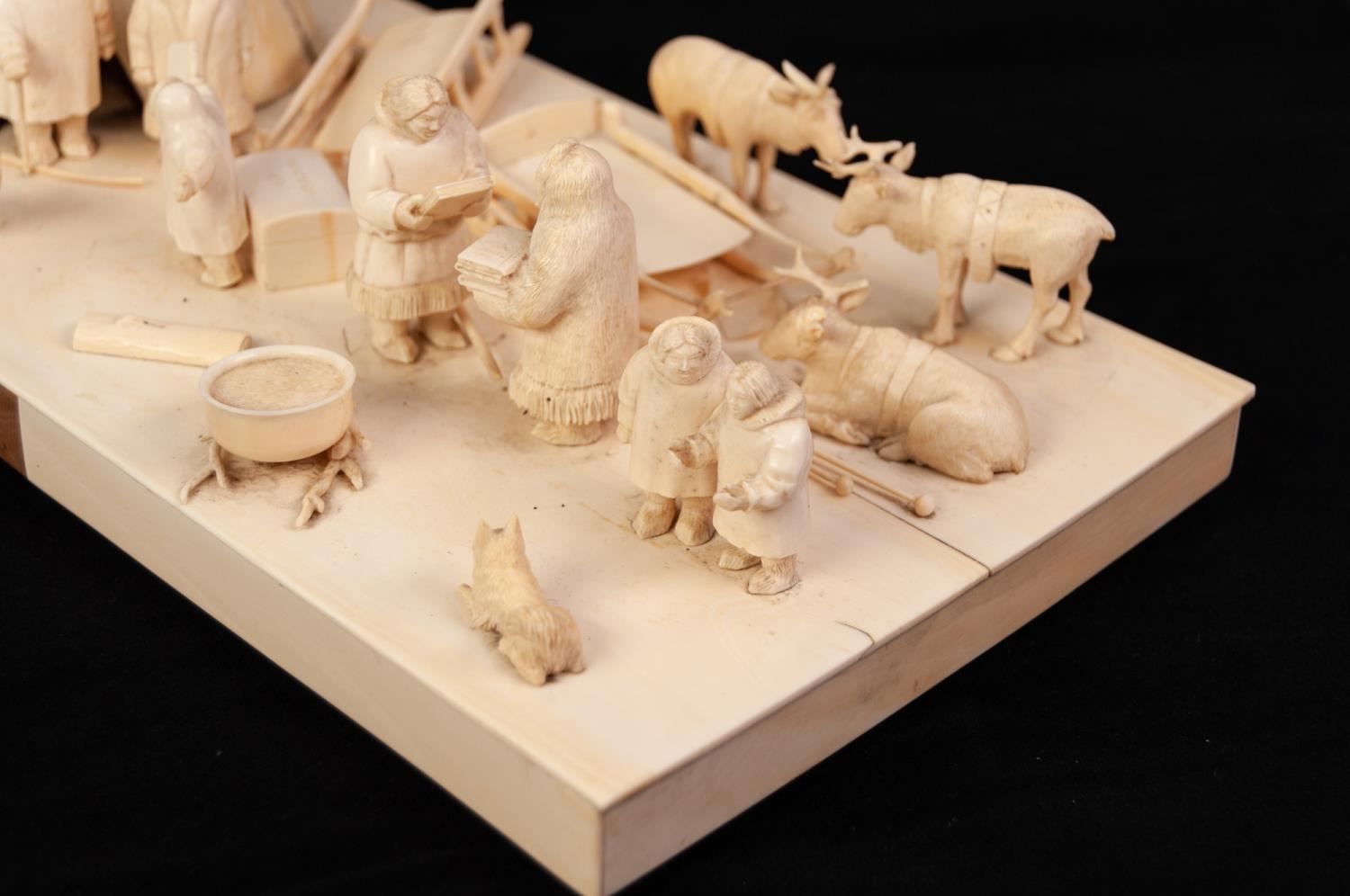 EARLY TWENTIETH CENTURY RUSSIAN CARVED IVORY GROUP, modelled as an ...