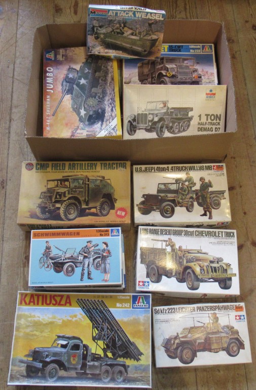 A collection of approximately twelve military model kits, to include ...