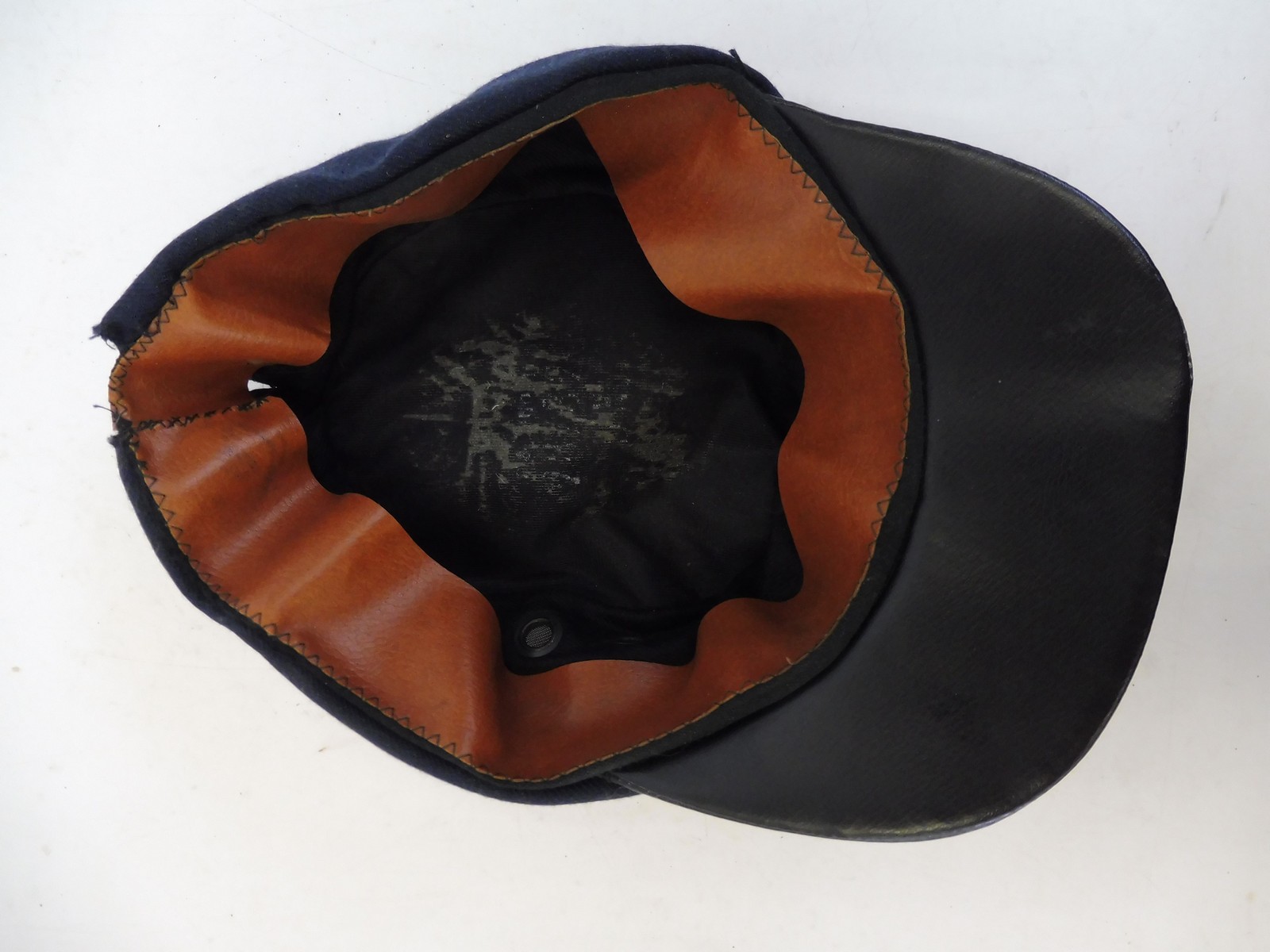 A steam train driver's cap, by repute worn by Reginald Beasley, bearing ...