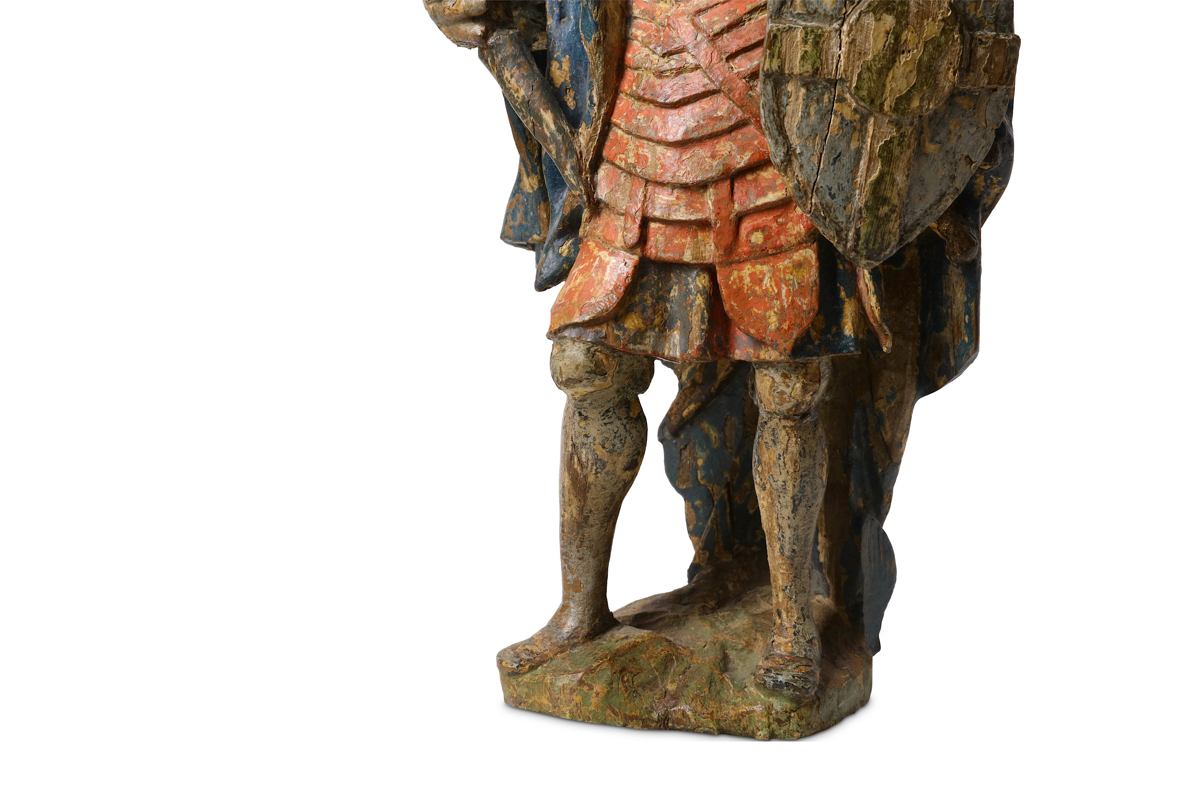 AN EARLY 16TH CENTURY FLEMISH POLYCHROME DECORATED AND CARVED OAK ...