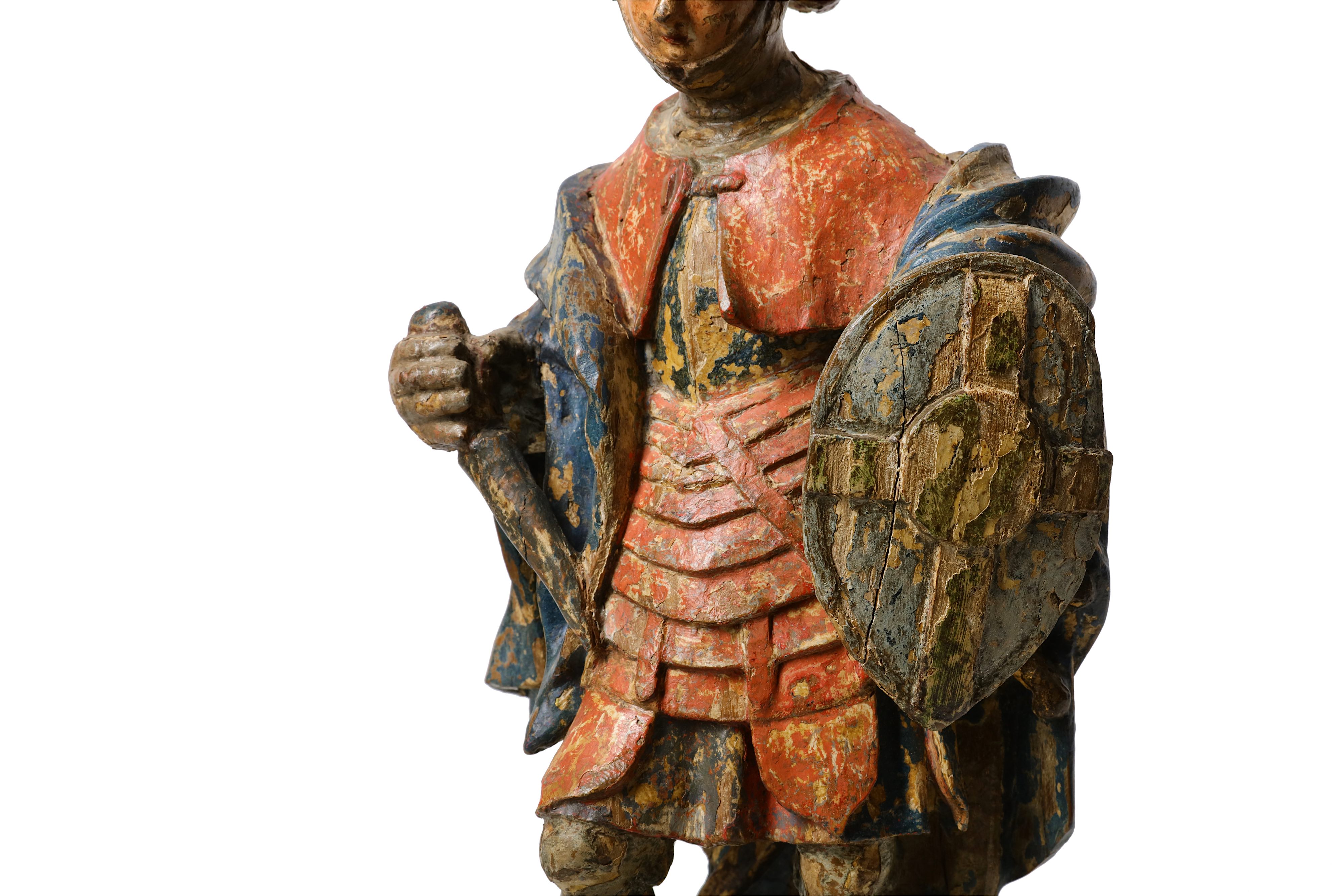 AN EARLY 16TH CENTURY FLEMISH POLYCHROME DECORATED AND CARVED OAK ...