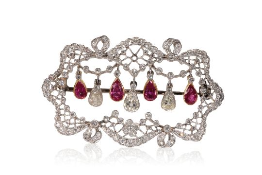 DIAMOND AND RUBY PLAQUE BROOCH, three pendeloque diamonds and four ...