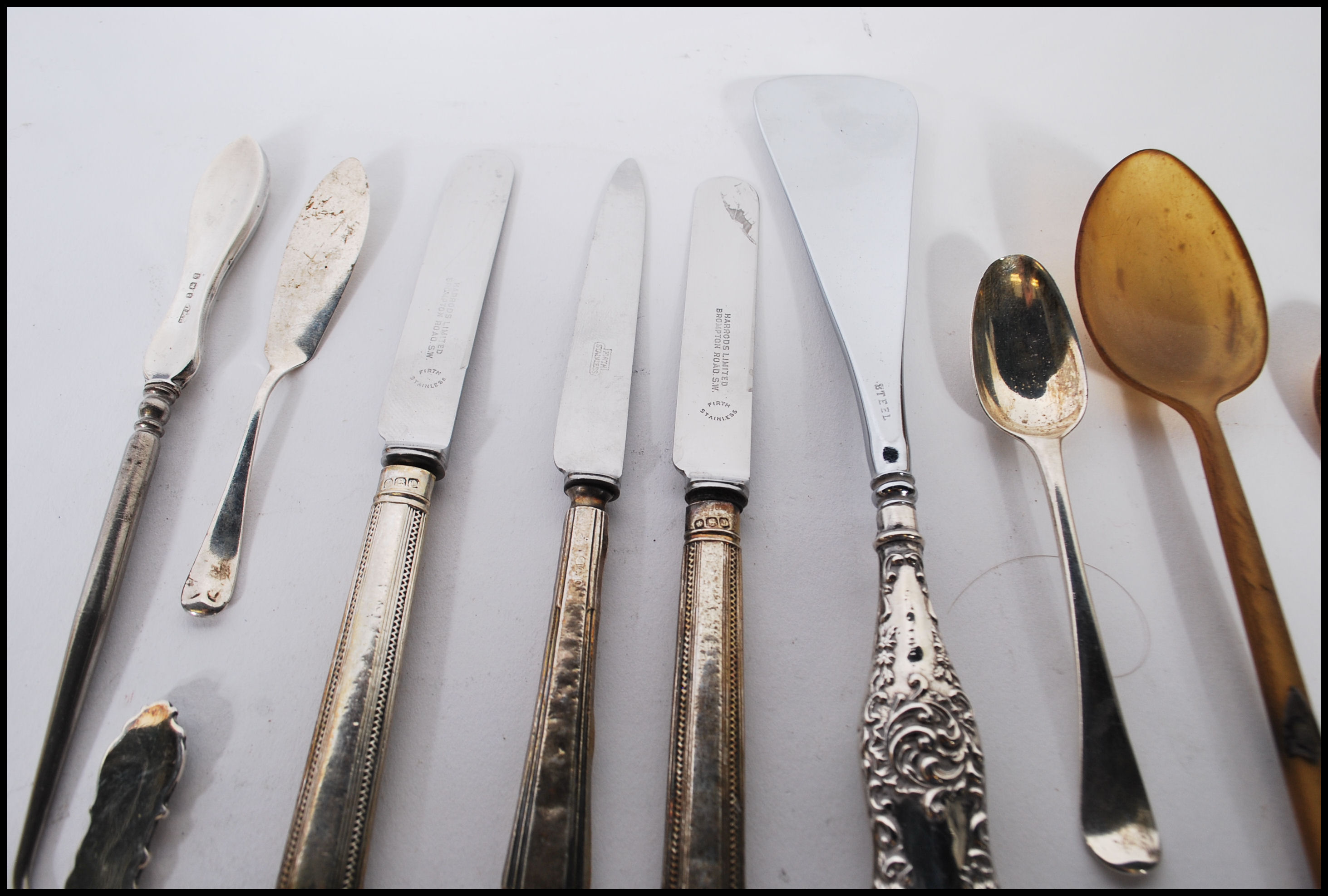 A collection of silver hallmarked flatware to include George Howson for ...