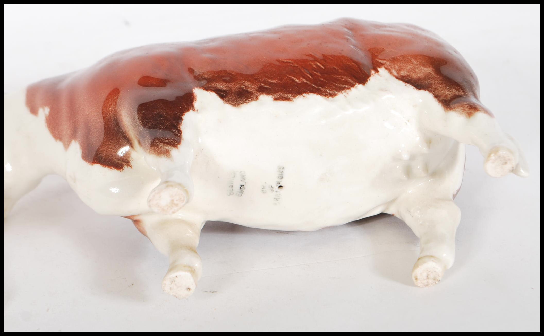 A collection of Beswick ceramic figurines modelled as cows and calves ...