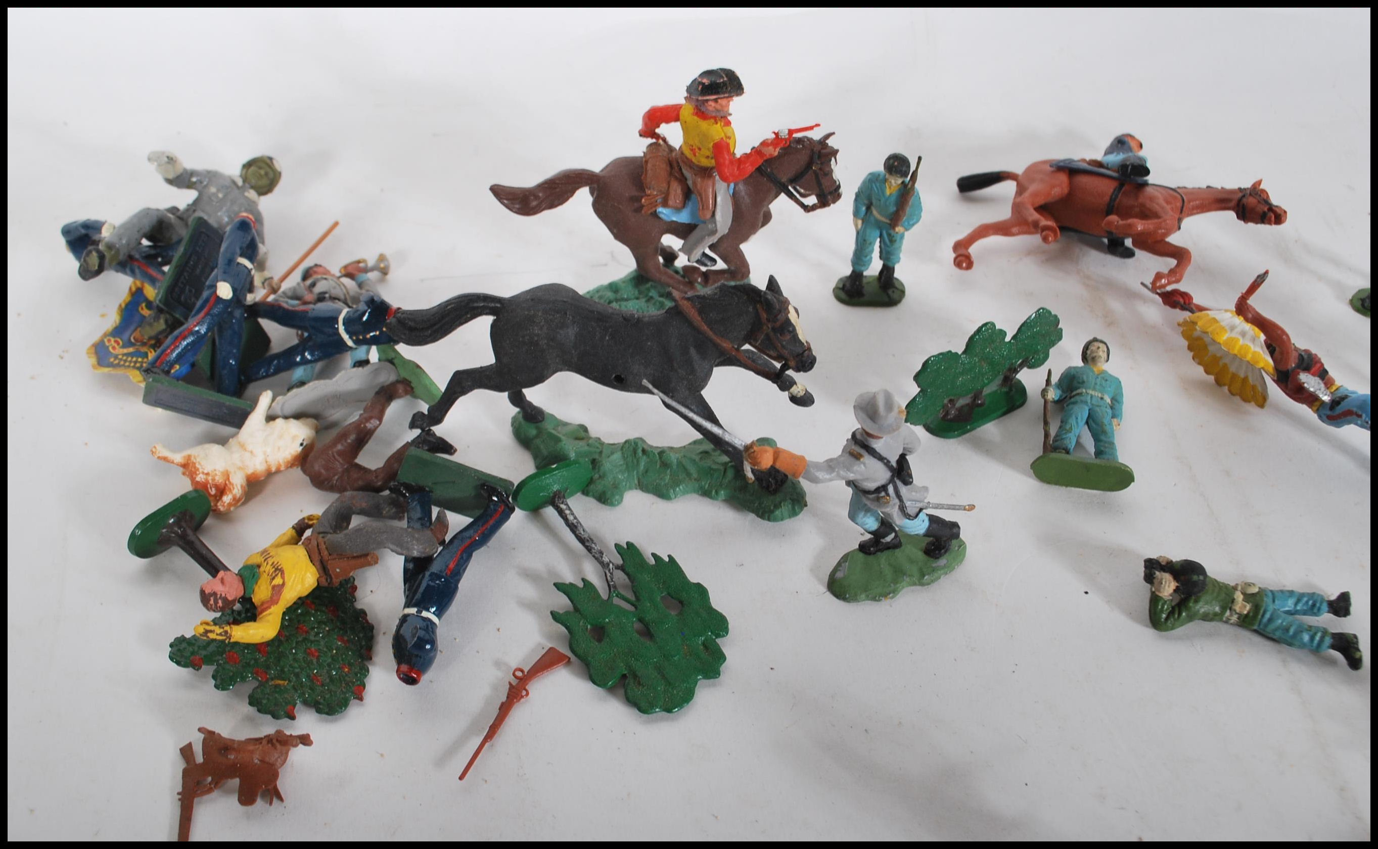 A collection of unboxed Britains Ltd made Swoppet plastic toy soldiers ...