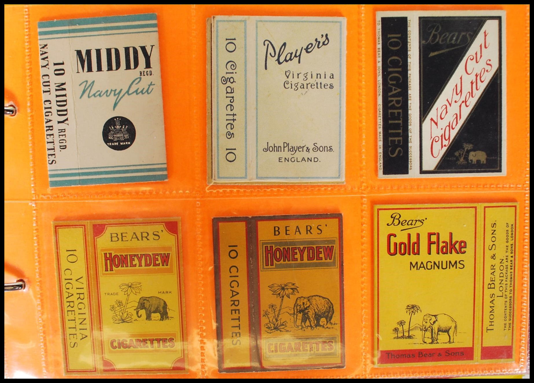 A collection of vintage 20th Century cigarette boxes over three albums ...
