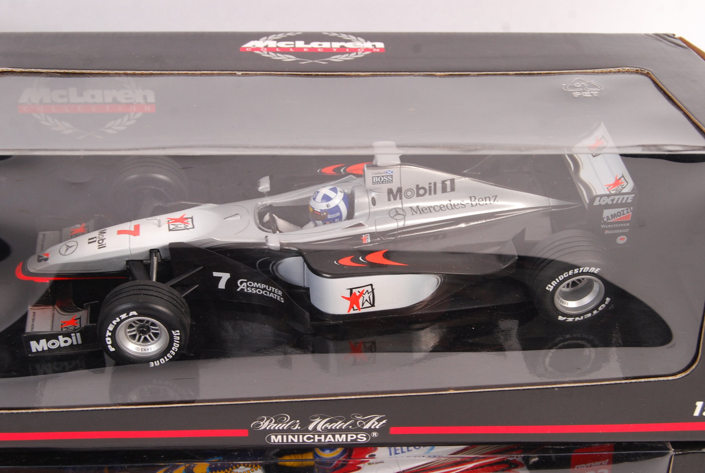 A collection of 4x assorted 1/18 scale precision diecast model racing ...
