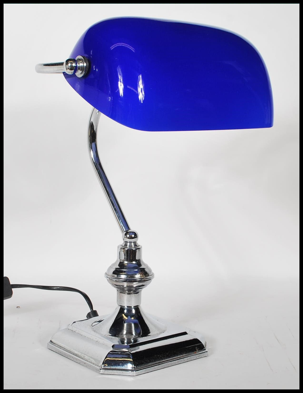 A vintage style bankers desk lamp having an adjustable blue glass shade ...