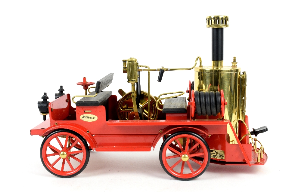 A Wilesco precision live steam fire engine D305 in red livery with ...