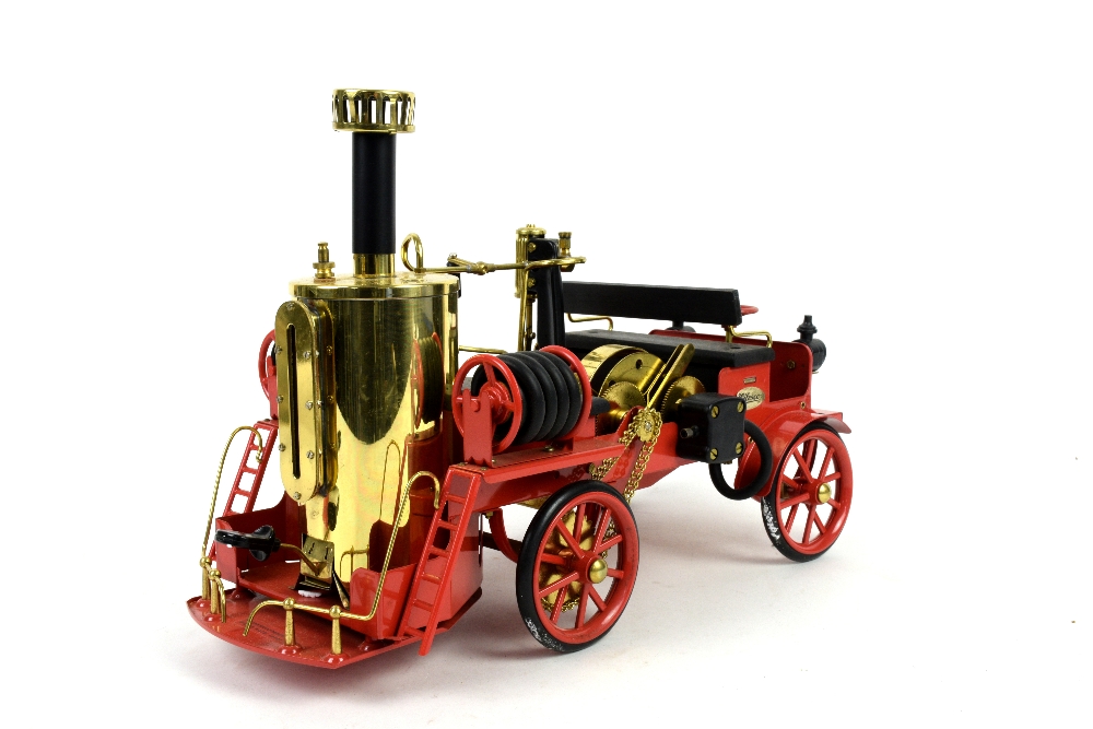 A Wilesco precision live steam fire engine D305 in red livery with ...