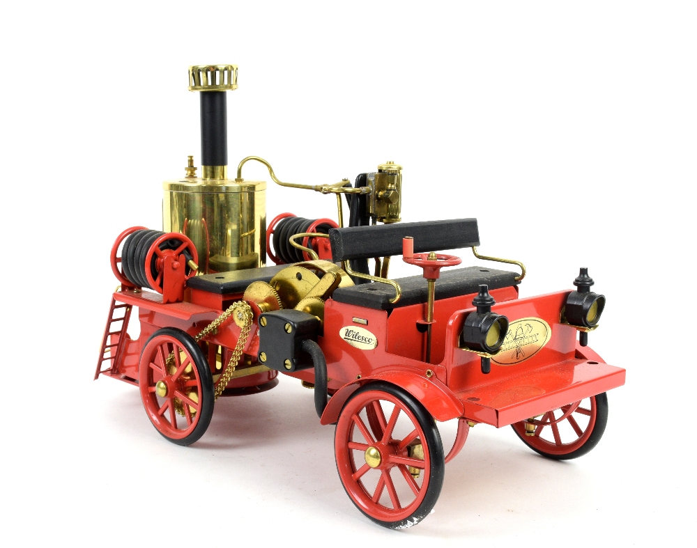 A Wilesco precision live steam fire engine D305 in red livery with ...