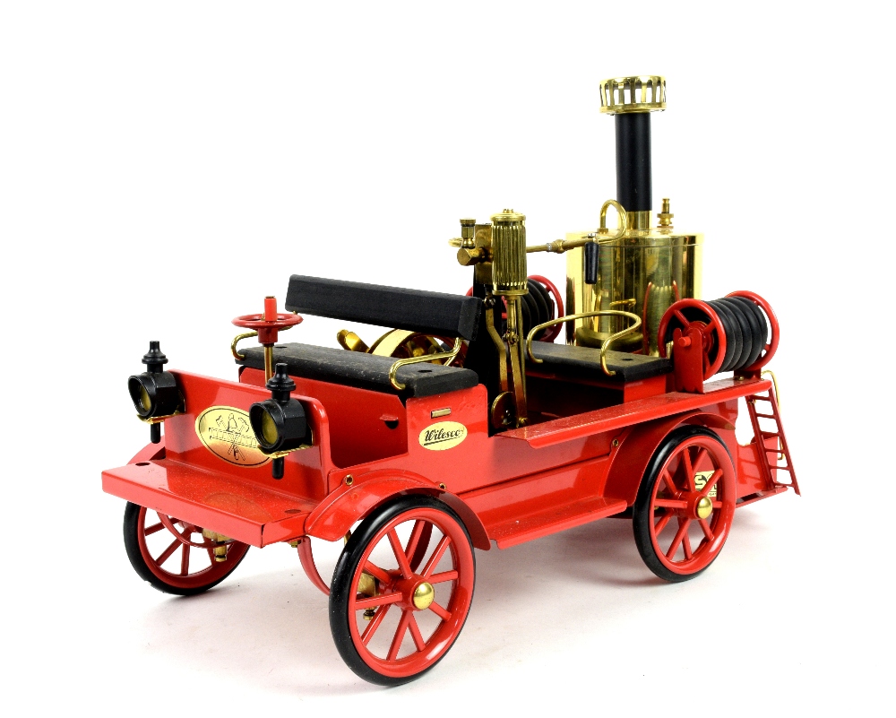 A Wilesco precision live steam fire engine D305 in red livery with ...