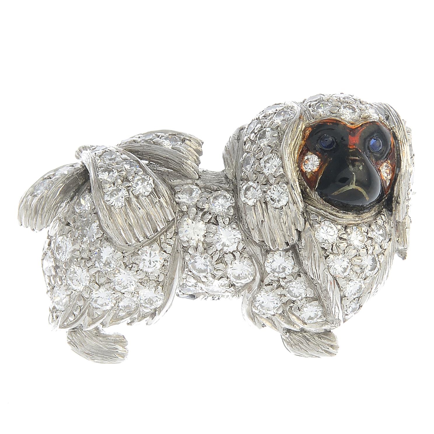An 18ct gold diamond Pekingese dog brooch, with sapphire eyes and ...