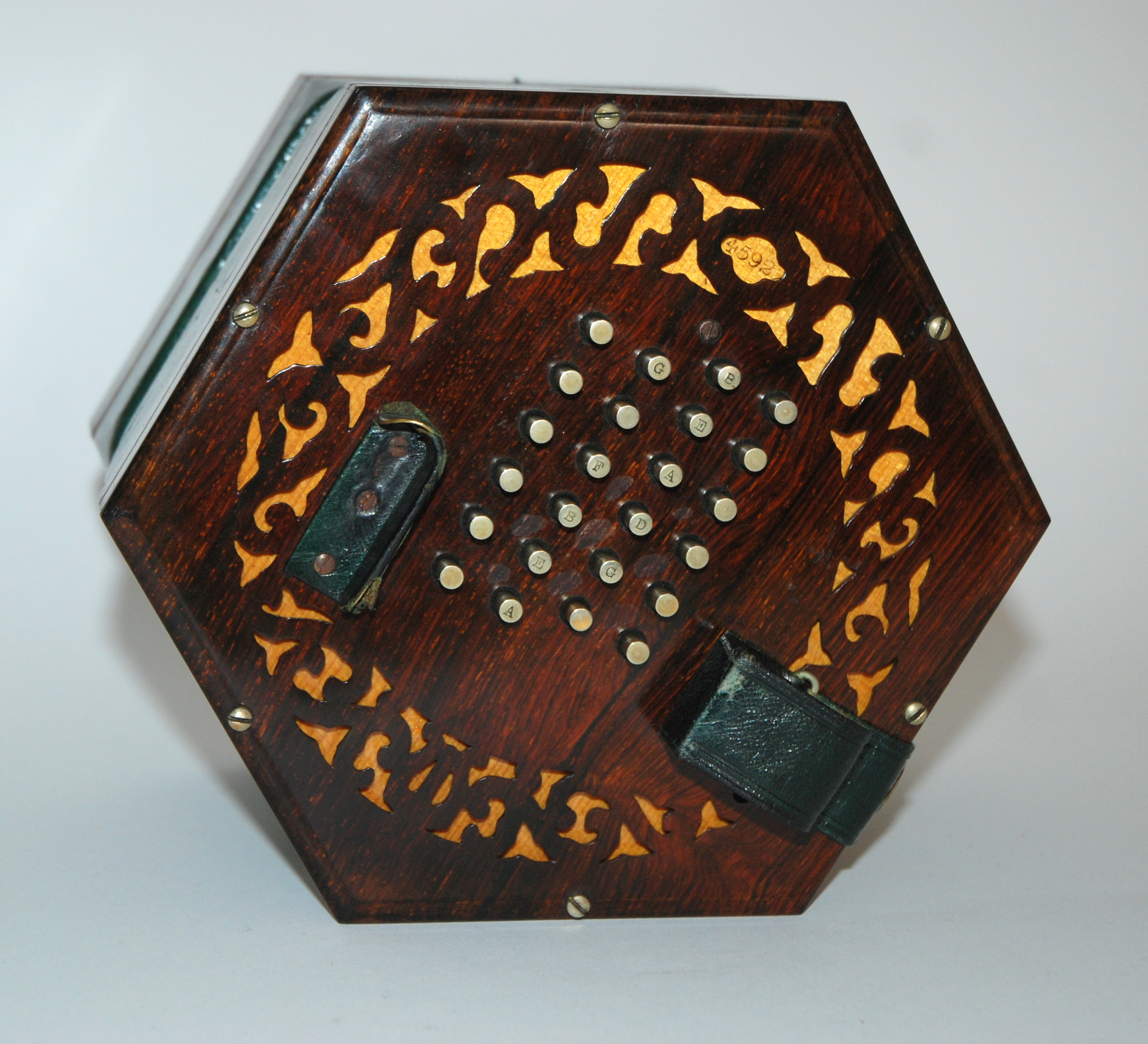 A VICTORIAN FORTY-EIGHT BUTTON WHEATSTONE CONCERTINA with pierced ...