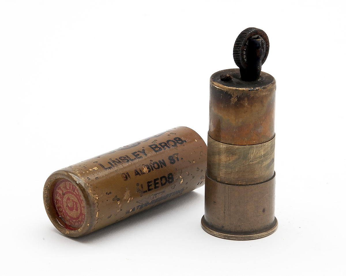 ELEY NOBEL - LINSLEY BROS.A BRASS PETROL CIGARETTE LIGHTER IN THE FORM ...