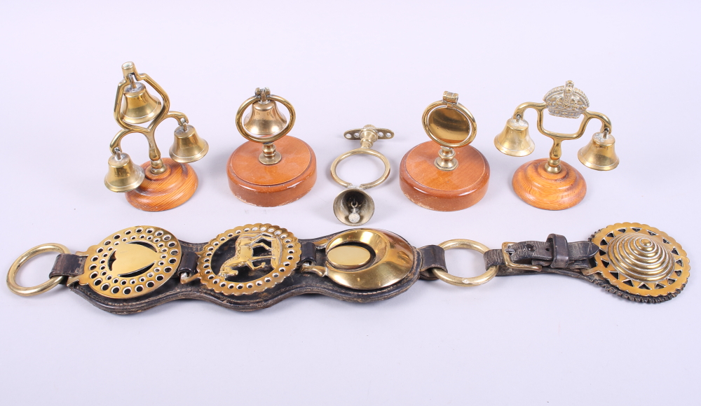 Five 19th century brass harness bells, on later wooden bases, and four ...