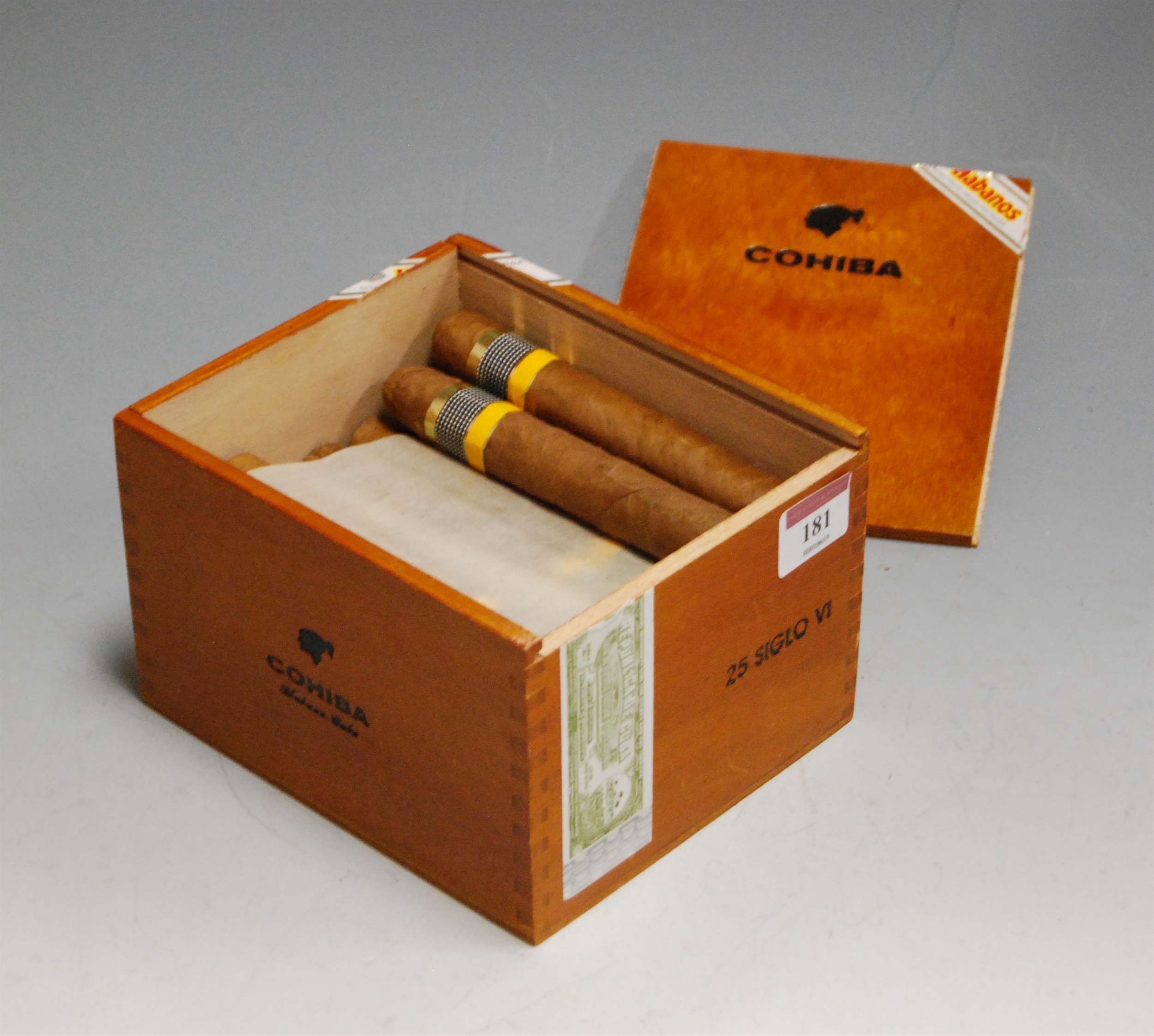 An open box of Habanas Cohiba Cuban cigars, the box stamped 25 ciglo VI ...