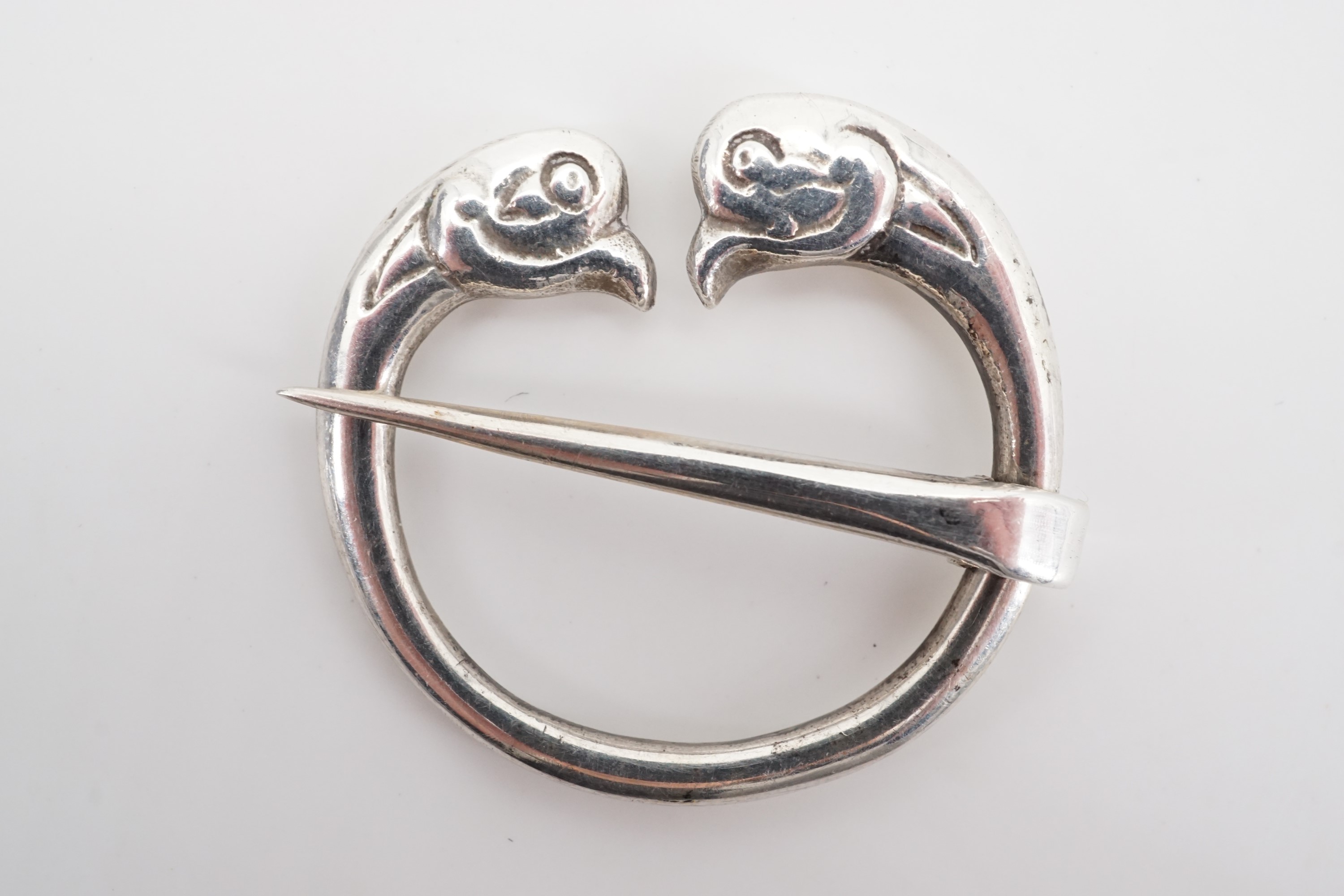 An Alexander Ritchie Iona Scottish silver penannular brooch, each ...