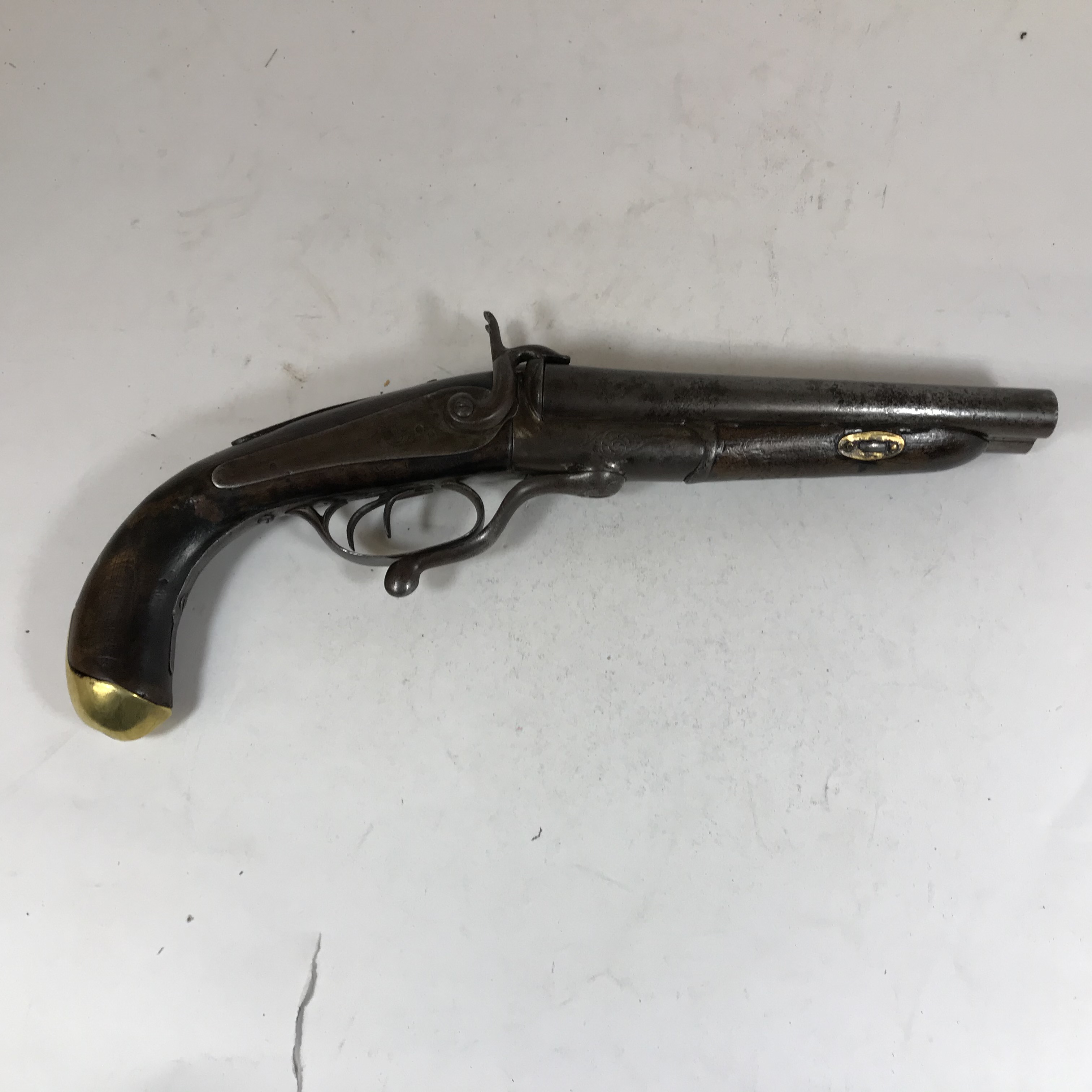 A DOUBLE BARRELLED PIN FIRE PISTOL. A Spanish made double-barrelled ...