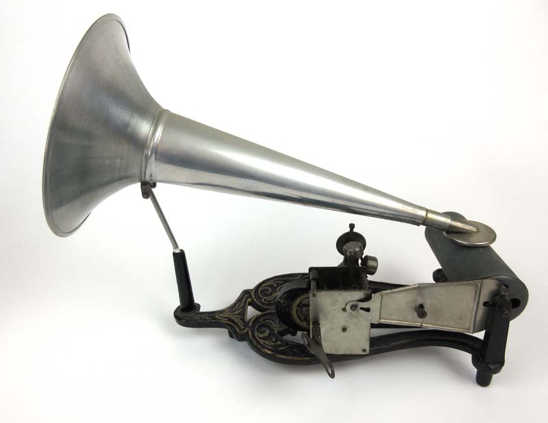 A Puck phonograph on a cast iron lyre shaped base c.1903 with a ...