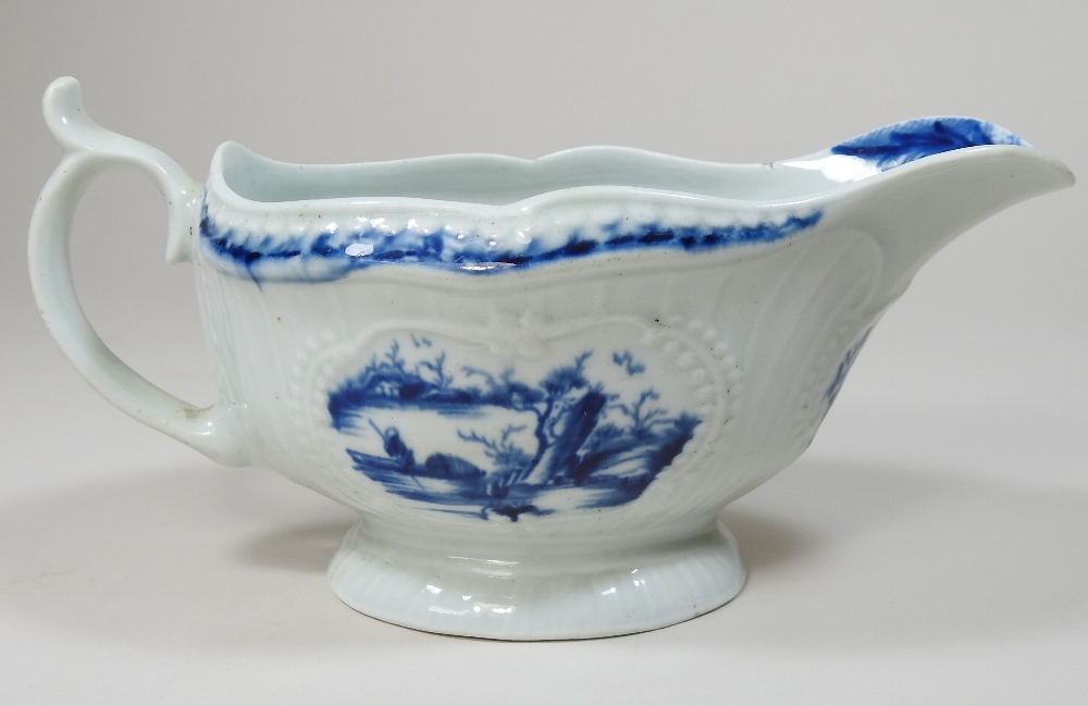 A Lowestoft porcelain blue and white sauce boat, circa 1770, of moulded ...