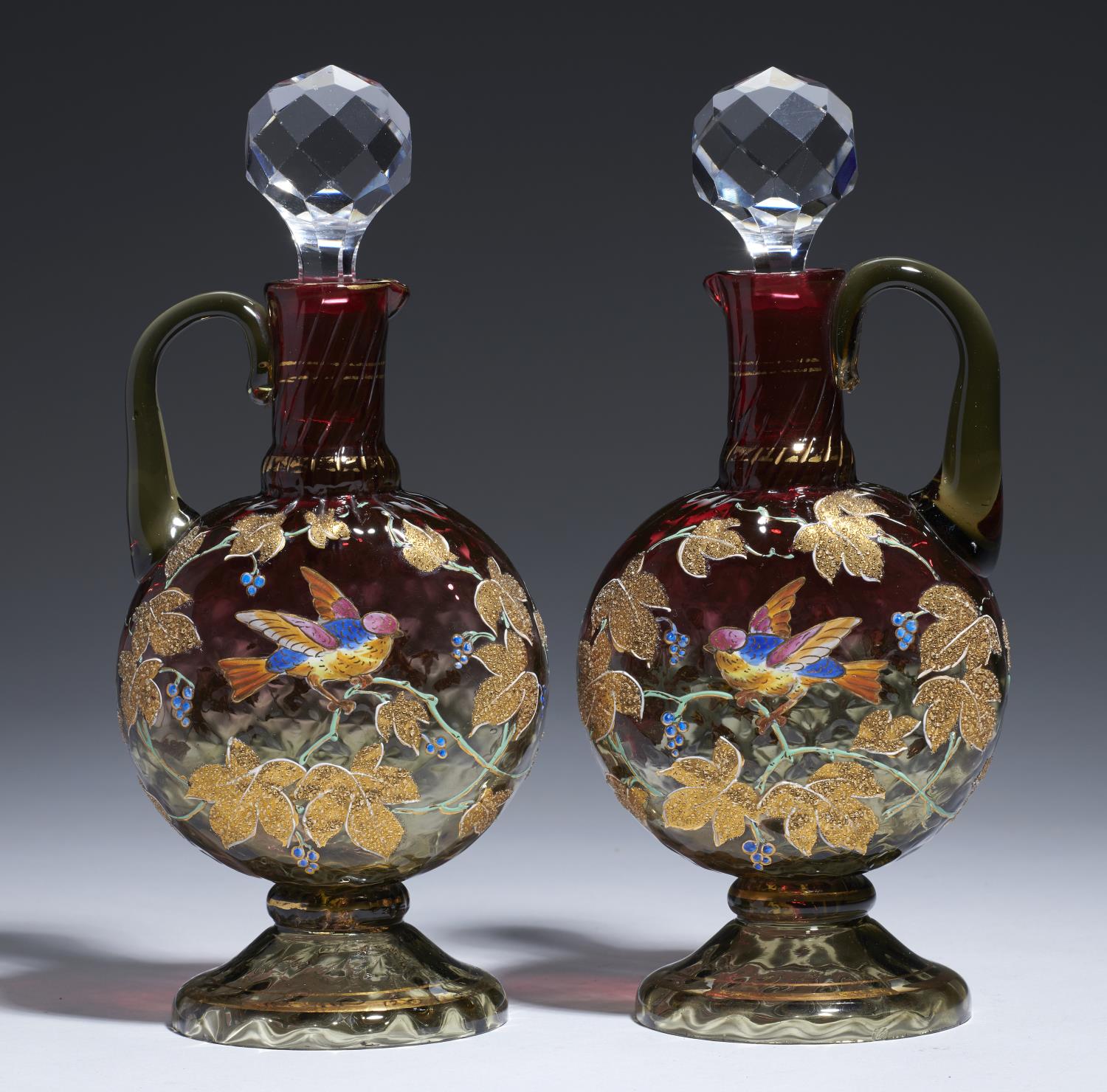 A PAIR OF MOSER ENAMELLED AND GILT WRYTHEN FLUTED AND SHADED CRANBERRY ...