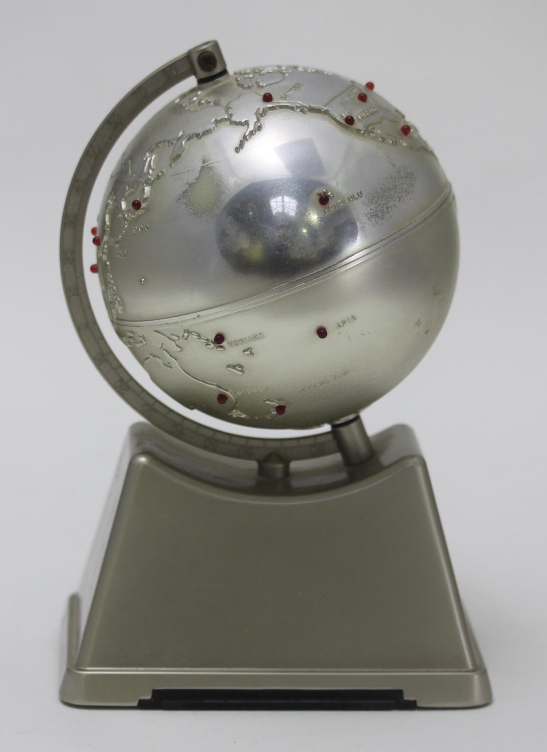 A novelty LCD Digital 'globe' desk alarm clock, with 24x red lights ...