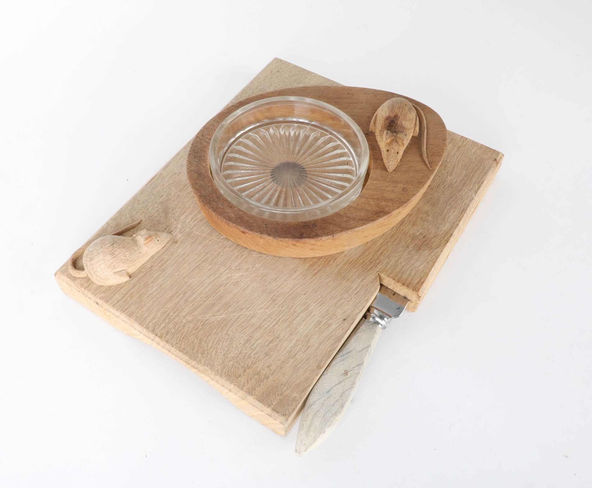 A Mouseman type chopping board and butter dish.