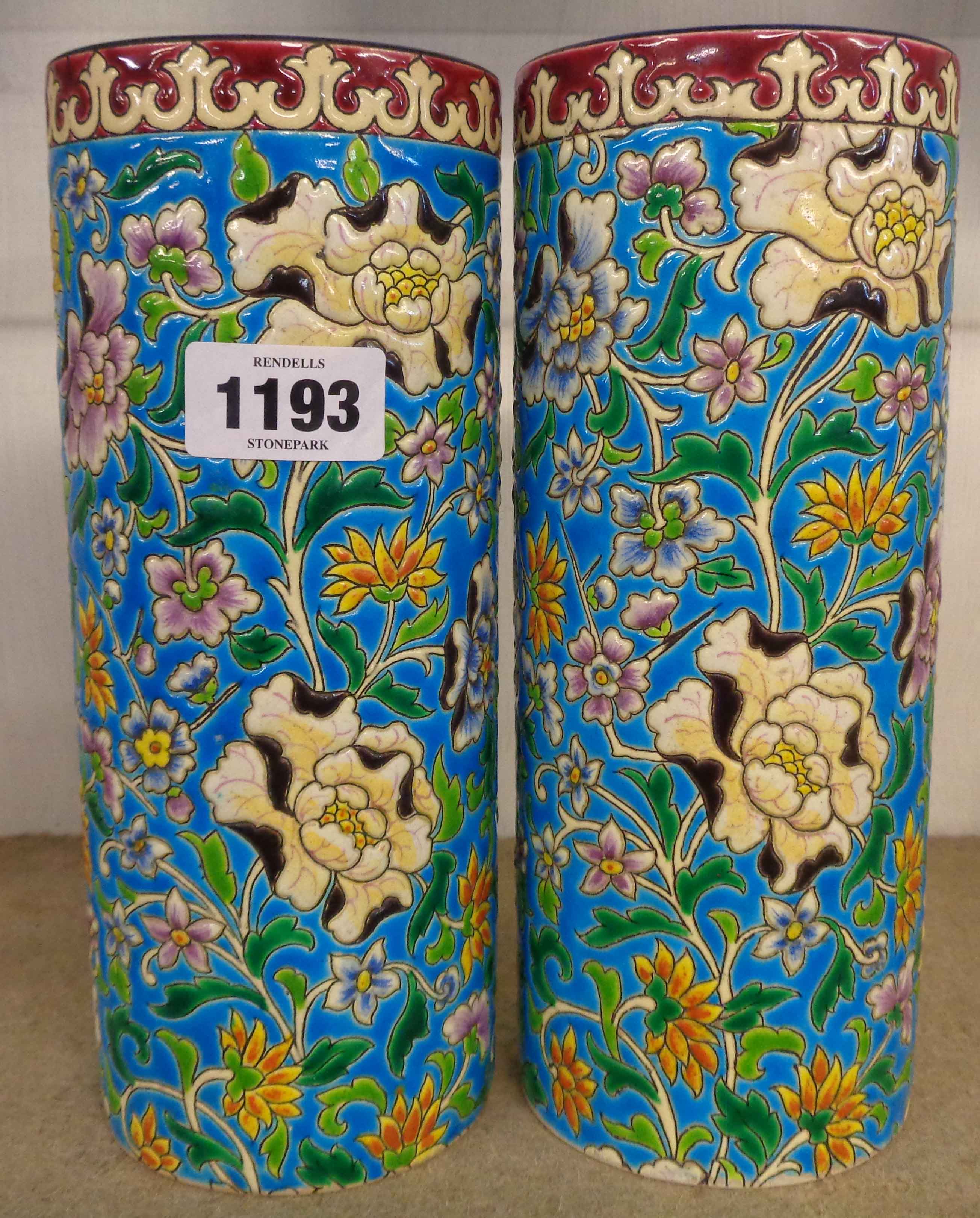 A pair of French Longwy Pottery vases with typical floral decoration