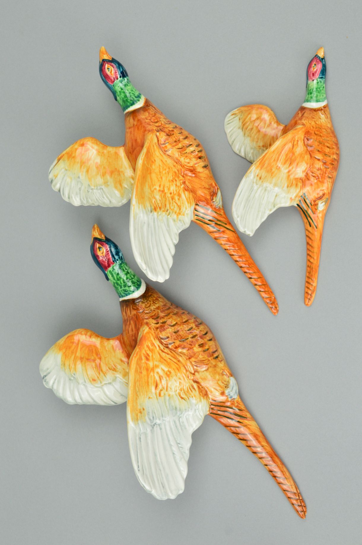 A SET OF THREE BESWICK BIRD WALL PLAQUES, 'Pheasant' No661/1/2/3 (3)