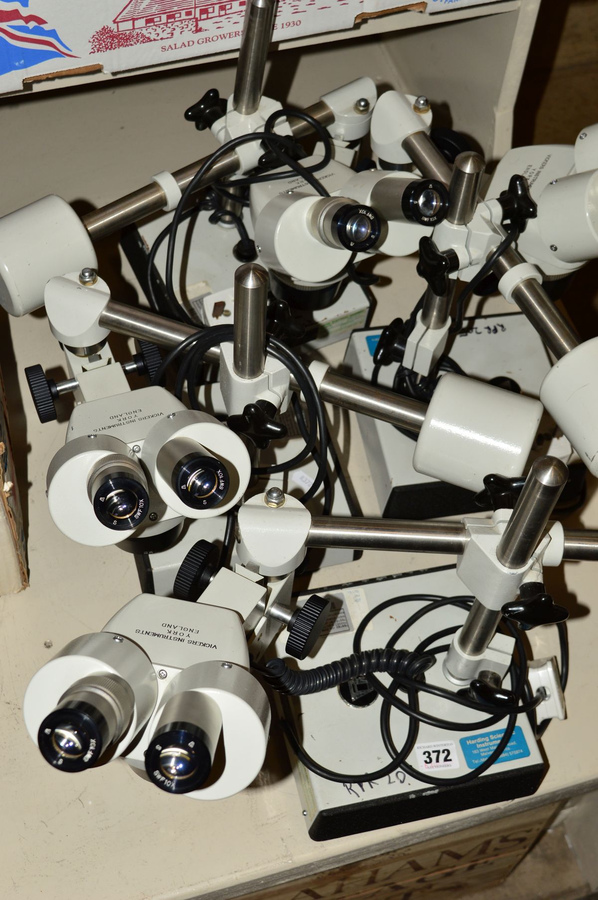 FOUR VICKERS BINOCULAR MICROSCOPES, together with a cased Griffin ...