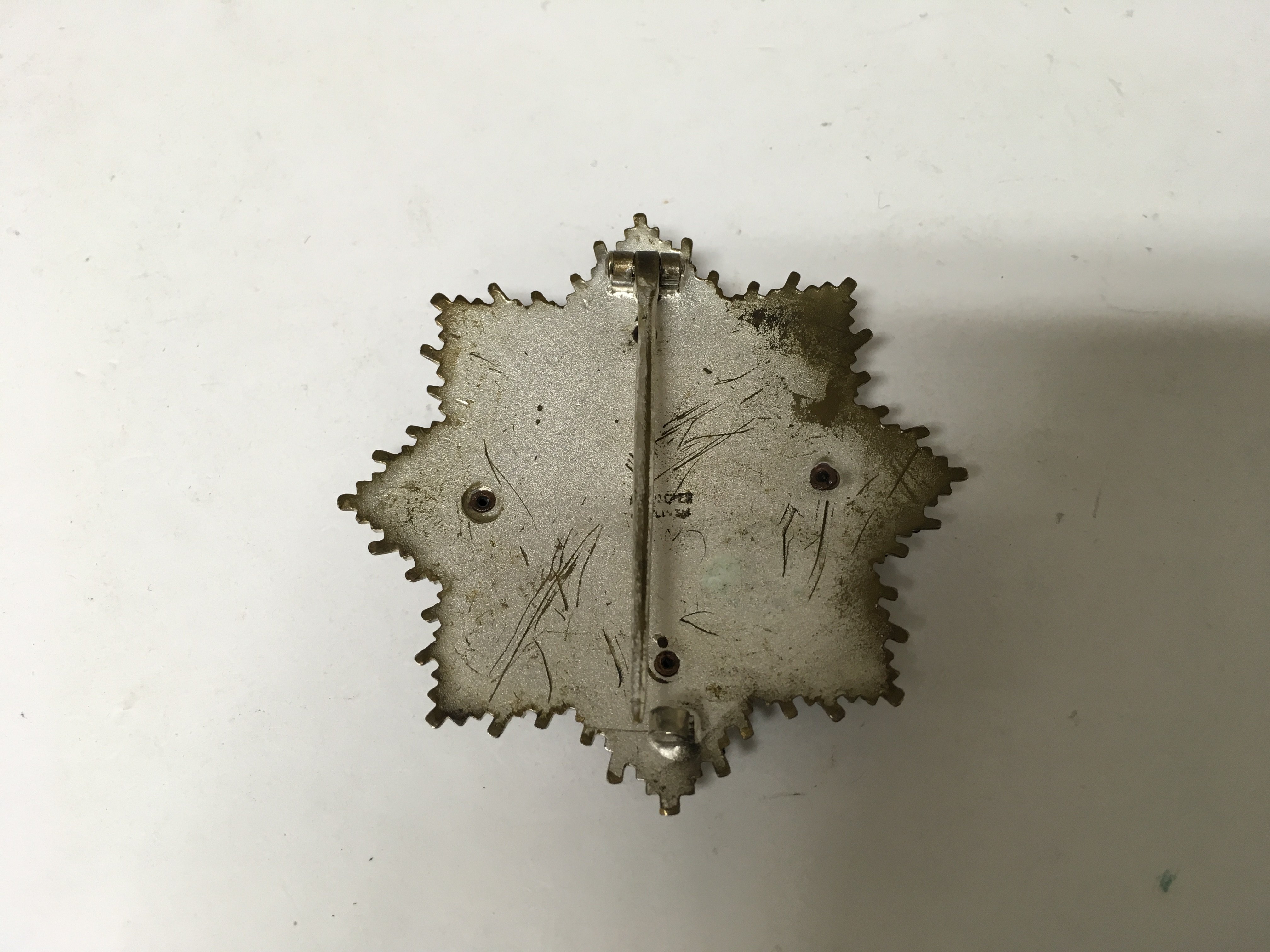 A German Third Reich WW2 Gold German Cross badge, indistinctly marked ...