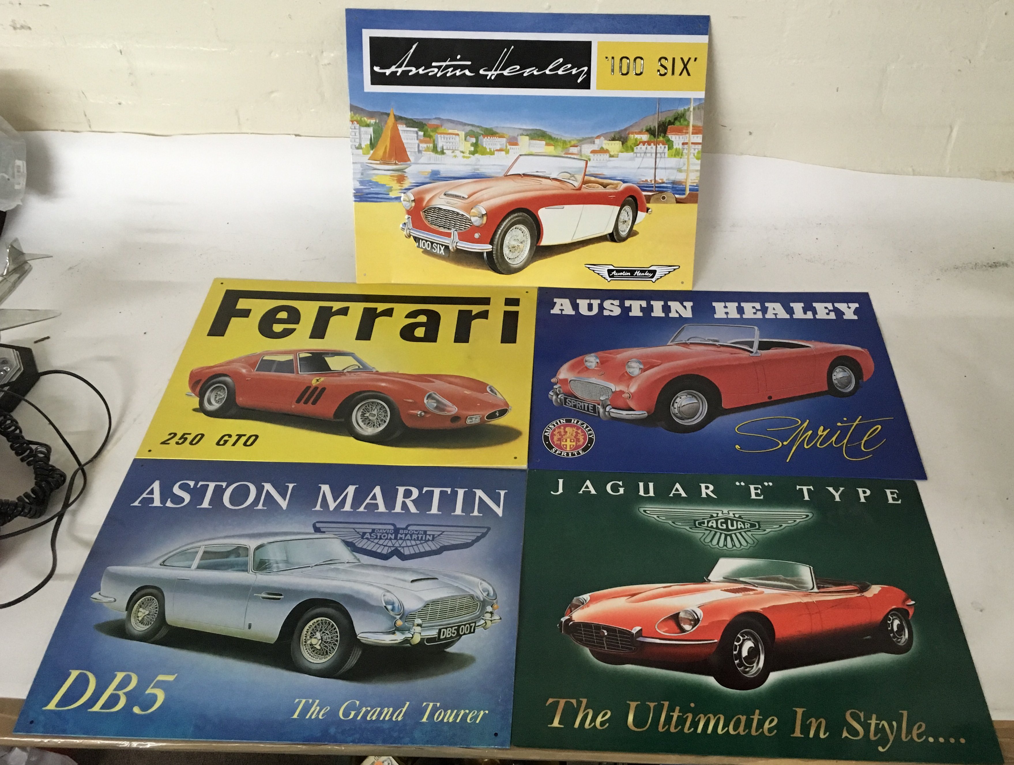 A small group of automotive memorabilia to include 5 aluminium signs ...