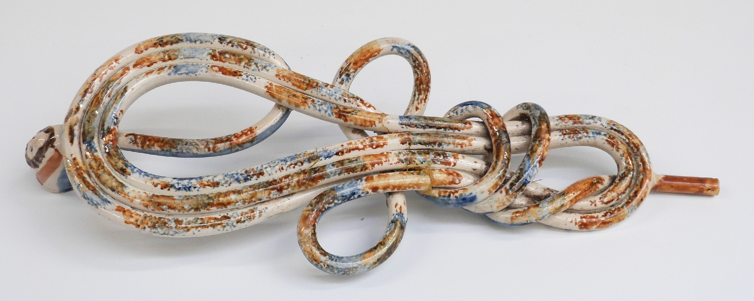 Prattware early 19thC puzzle pipe with mask decoration, L27cm