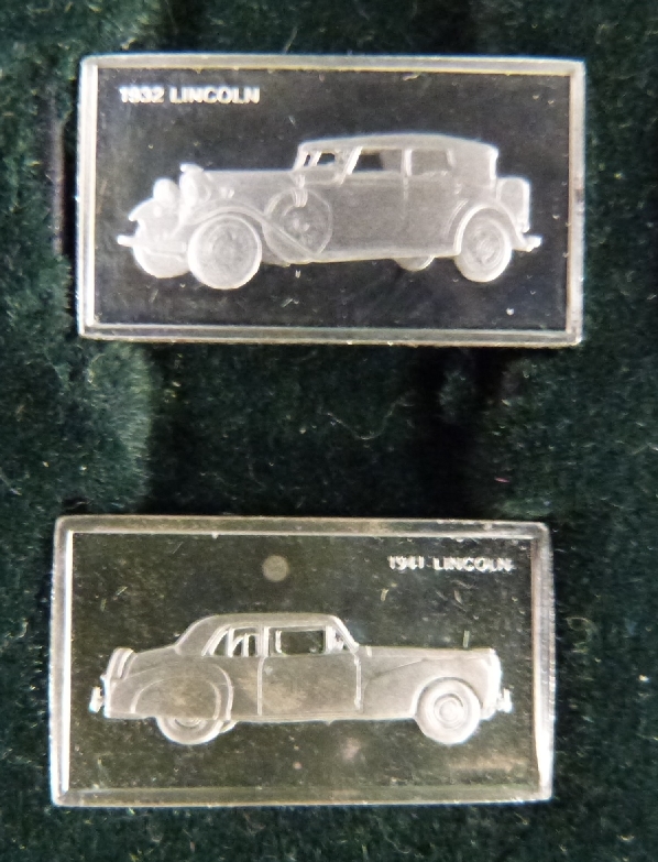 A cased set of silver '100 Greatest Cars' miniature ingots comprising ...