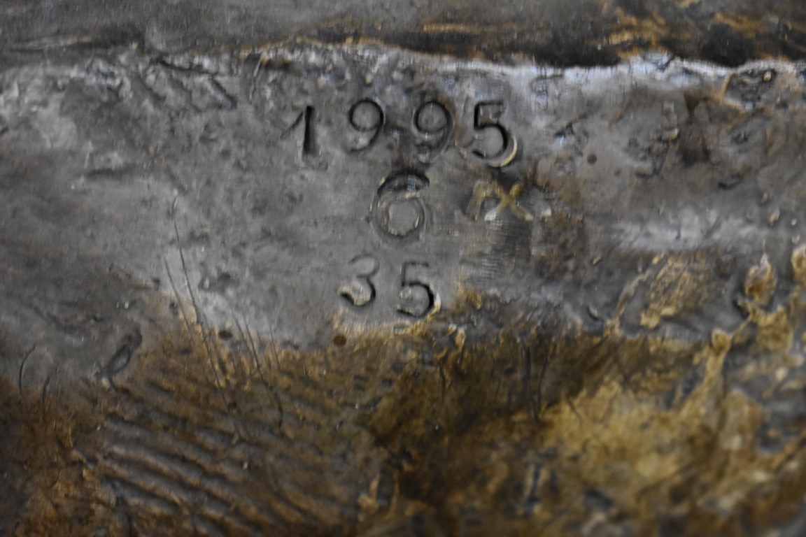 A large Goldscheider pottery figure group of a girl and lion, impressed ...