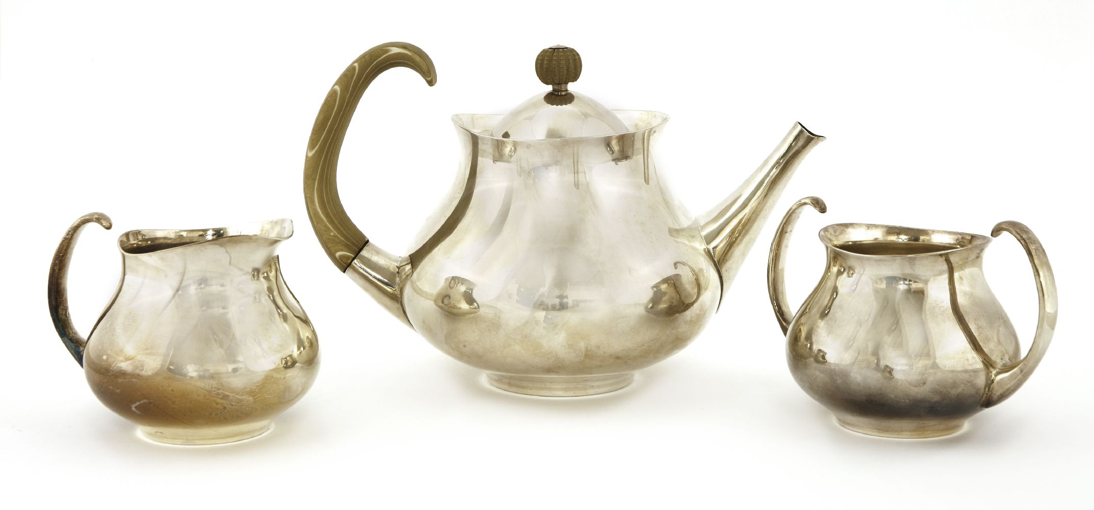A Mappin and Webb silver-plated three-piece tea set, designed by Eric ...