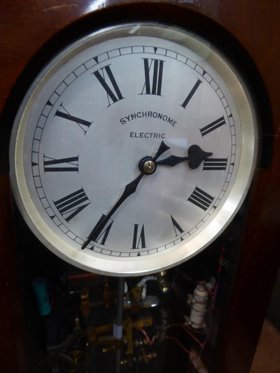 A Synchronome electric master clock, with pendulum, in mahogany case ...