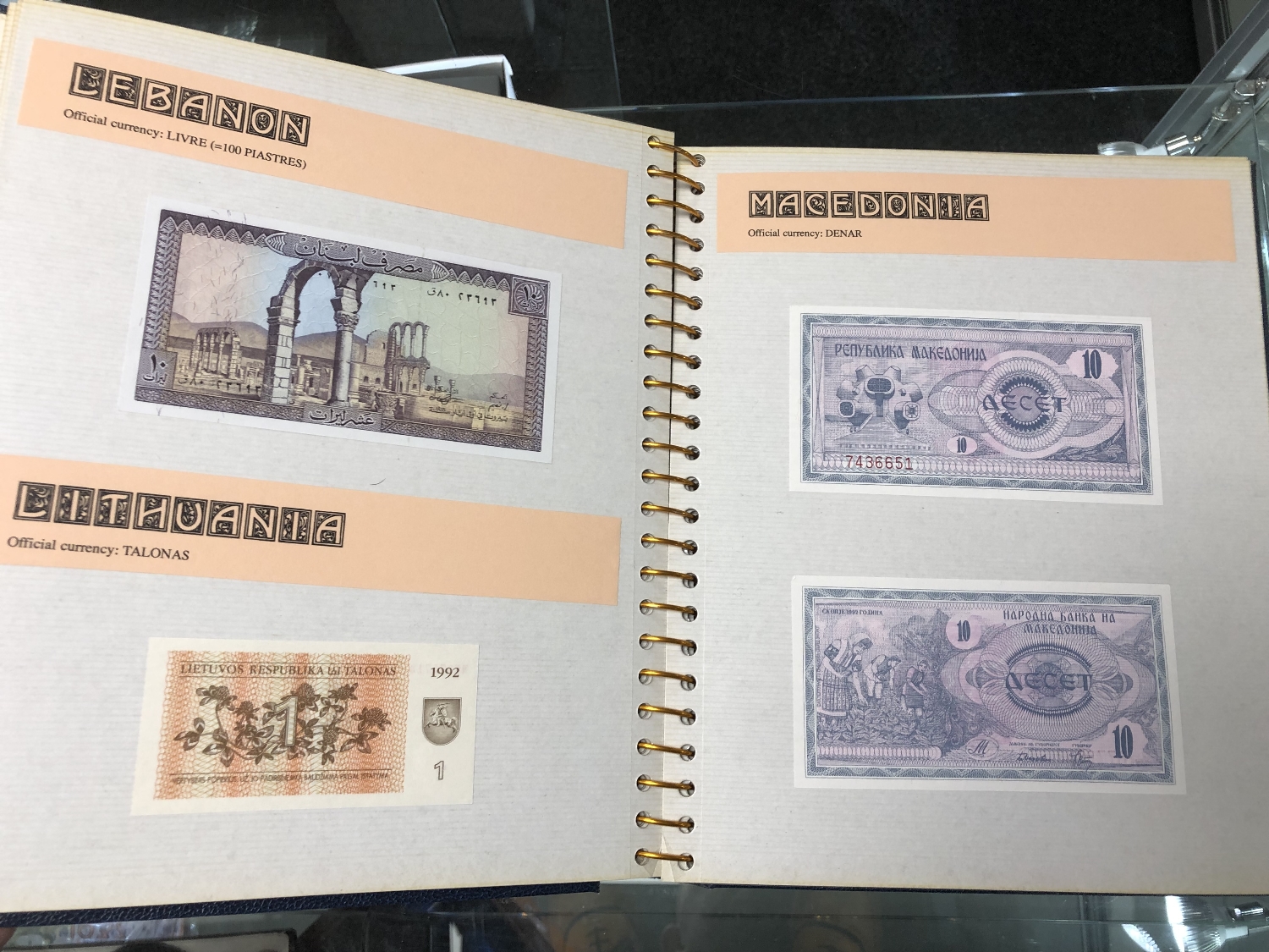 An International Currency Collection album containing banknotes of the ...